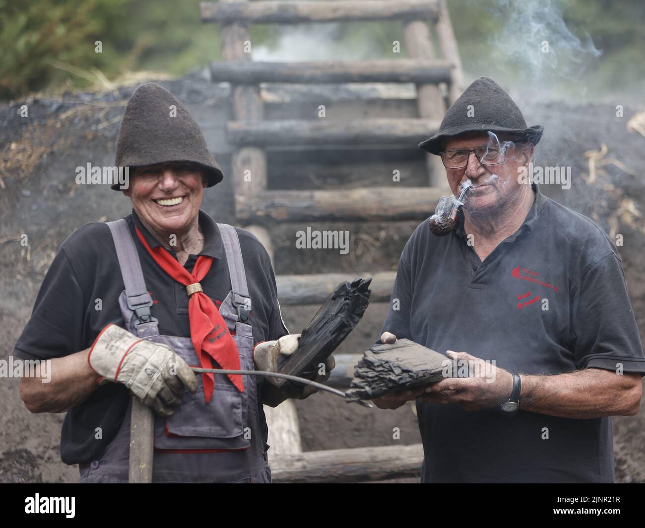 Hasselfelde, Germany. 13th Aug, 2022. Hobby charcoal burners Hartmut ...