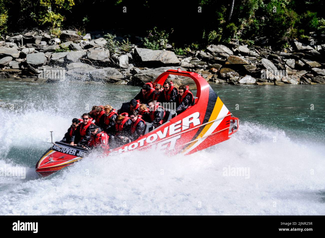 Visitors enjoy the high-speed thrills on a 'Shotover jet flat bottom ...