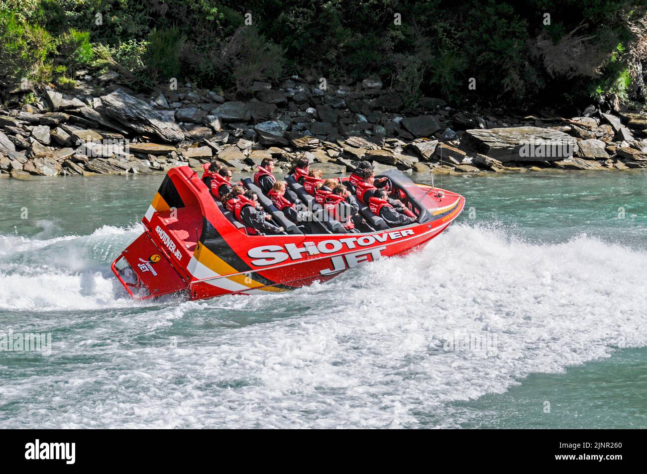Visitors enjoy the high-speed thrills on a 'Shotover jet flat bottom ...
