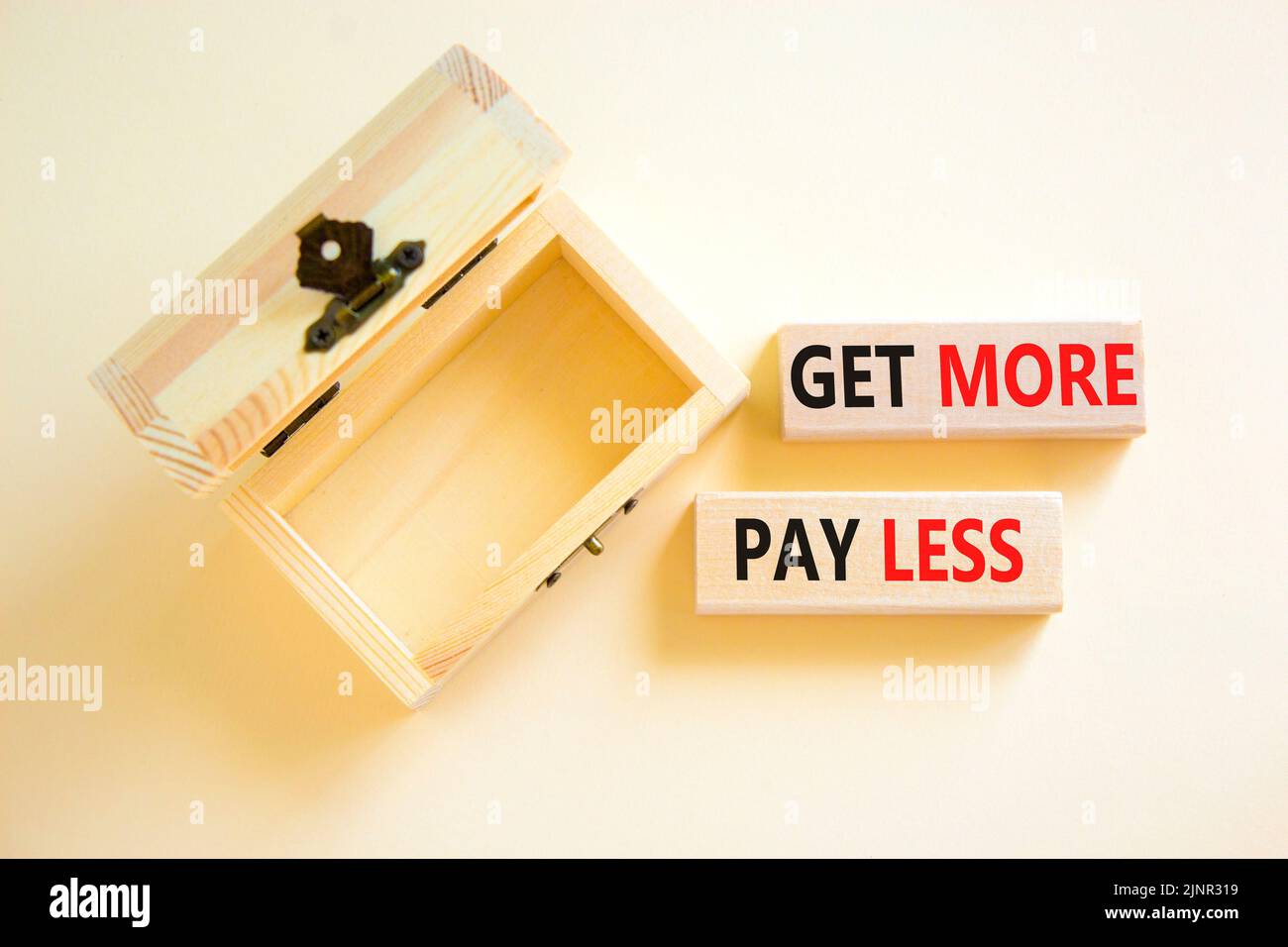 Get more pay less symbol. Concept words Get more pay less on wooden ...