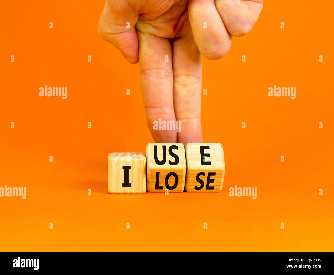 I use or lose it symbol. Concept words I use and I lose on wooden cubes ...