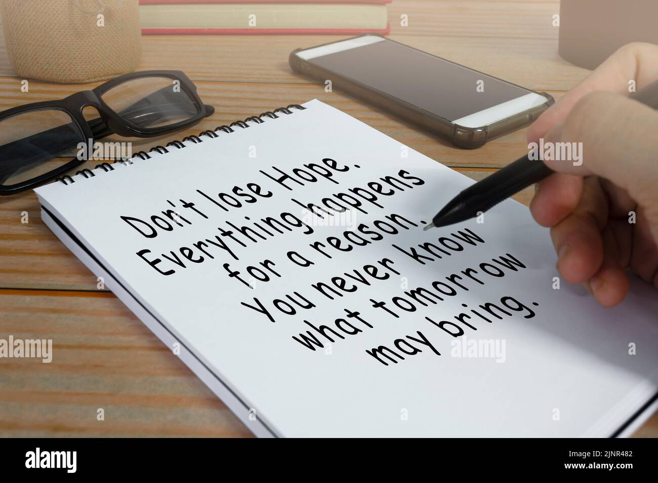 Motivational and inspirational quote written on notepad Stock Photo - Alamy