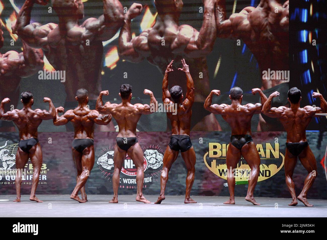 Islamabad. 13th Aug, 2022. Contestants compete during a bodybuilding ...
