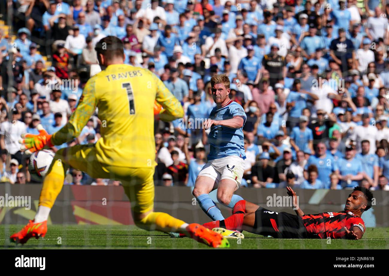 Bournemouth goalkeeper Mark Travers saves a shot from Manchester City's ...