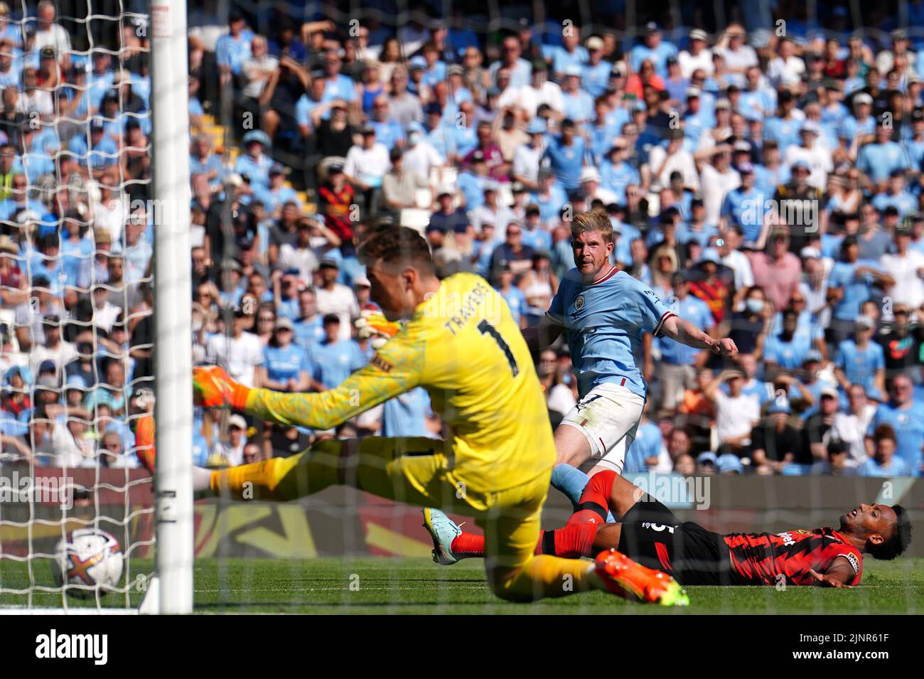 Bournemouth goalkeeper Mark Travers saves a shot from Manchester City's ...