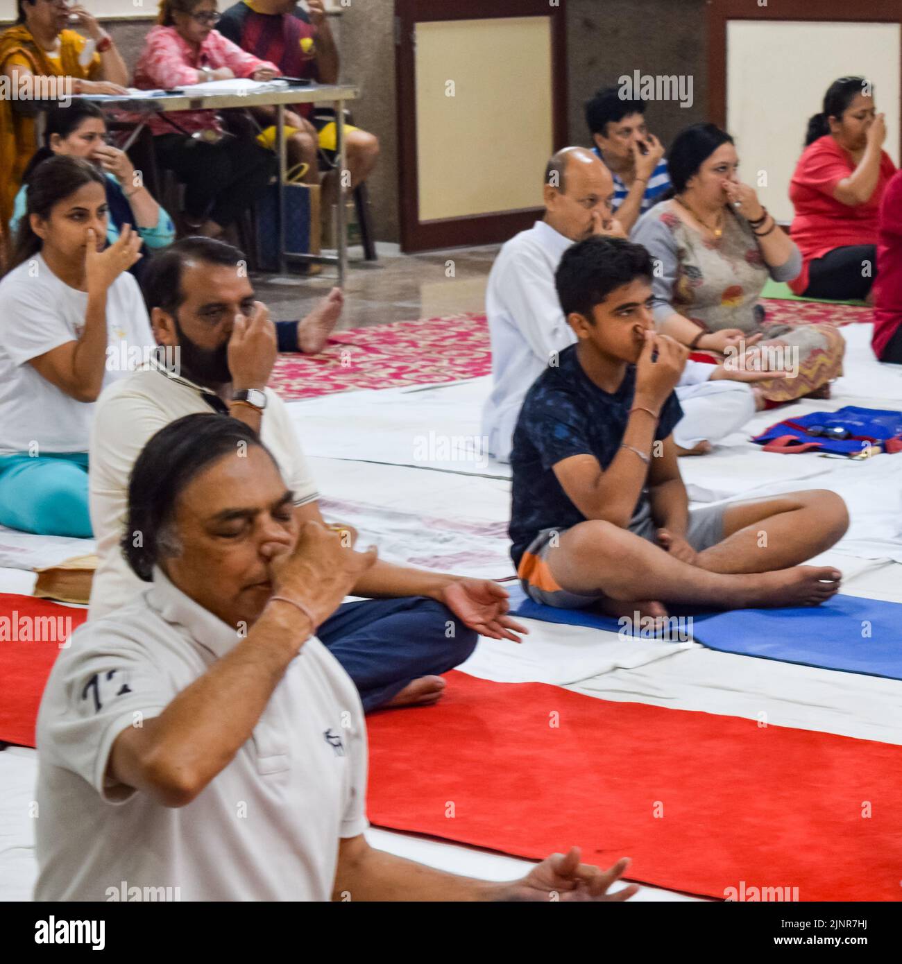 New Delhi, India, June 19 2022 -Group Yoga exercise session for people ...