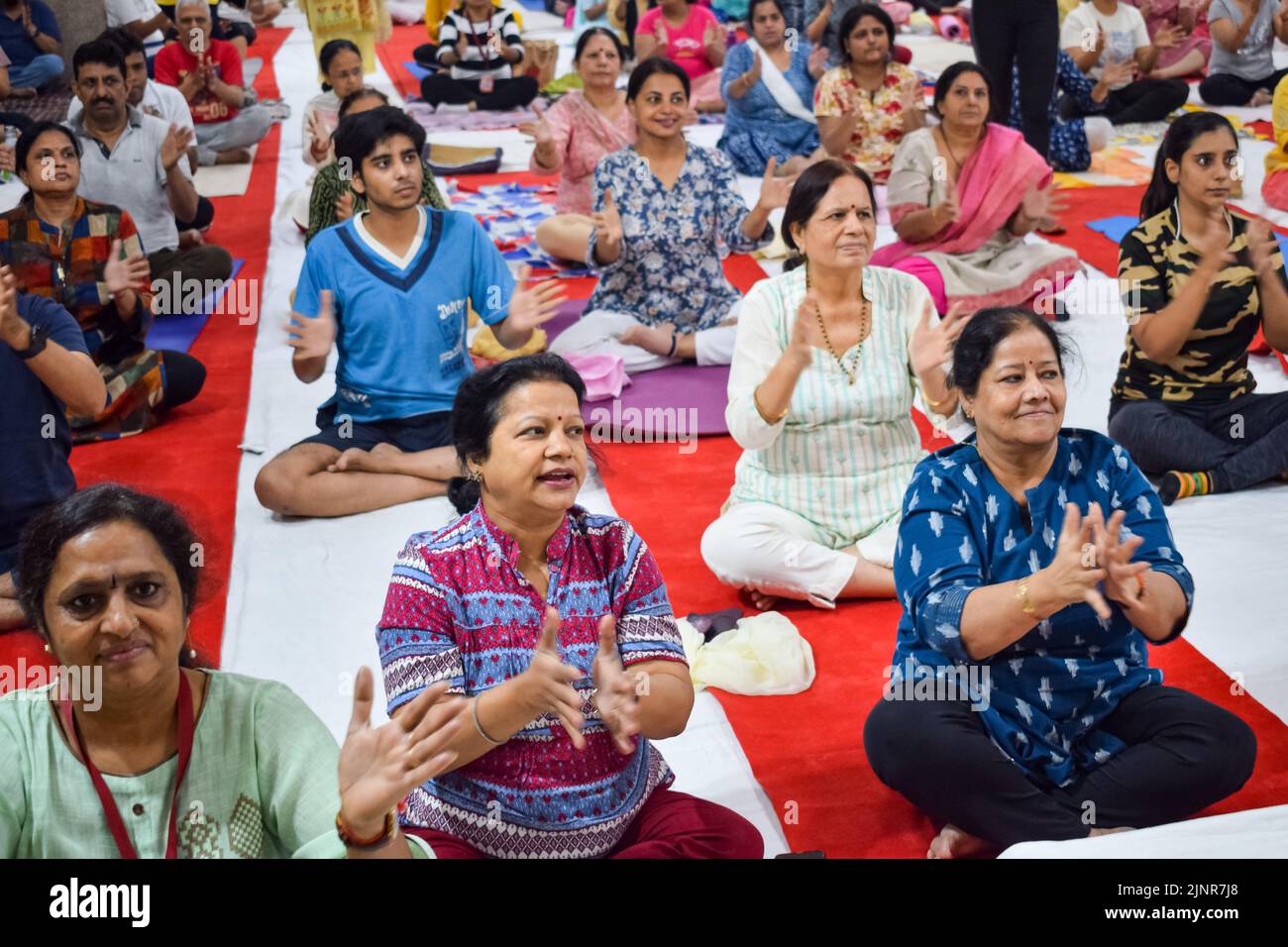 New Delhi, India, June 19 2022 -Group Yoga exercise session for people ...