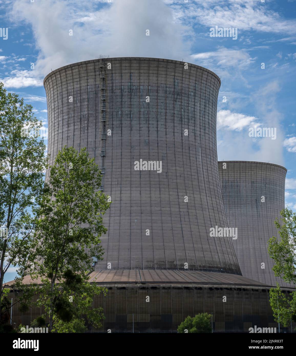 steam rising from cooling towers for a nuclear power plant in the ...