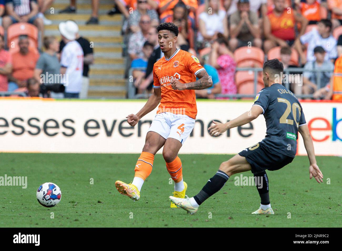 Jordan Lawrence-Gabriel #4 of Blackpool passes the ball in, on 8/13 ...