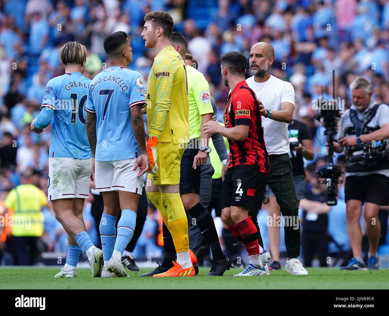 Manchester City manager Pep Guardiola speaks to Bournemouth's Lewis ...