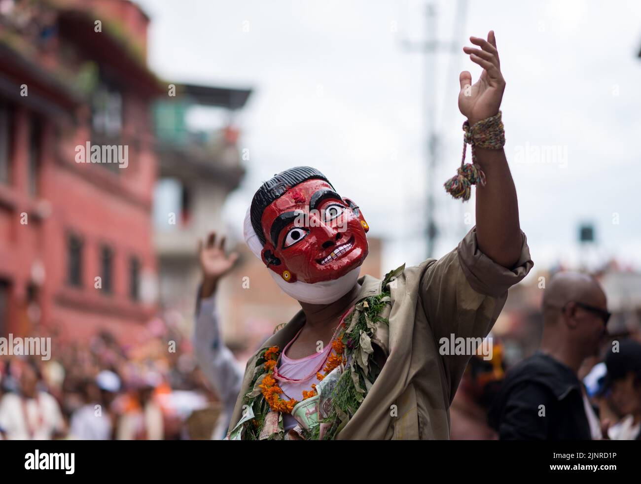 A man dressed in a traditional costume performs a holy dance during the ...