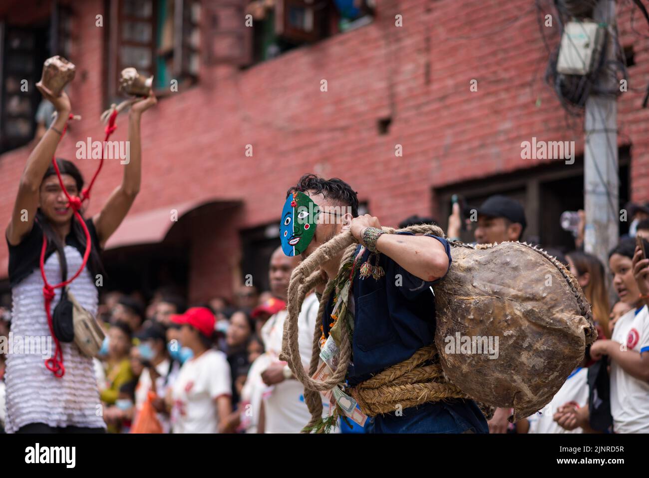 A man dressed in a traditional costume performs a holy dance during the ...