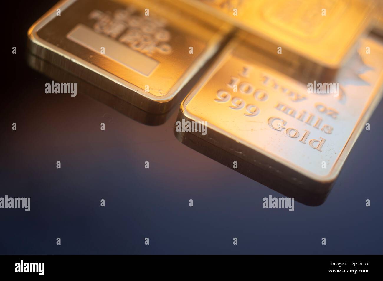 Solid pure 999.9 gold bullion ingot bars photo Stock Photo - Alamy