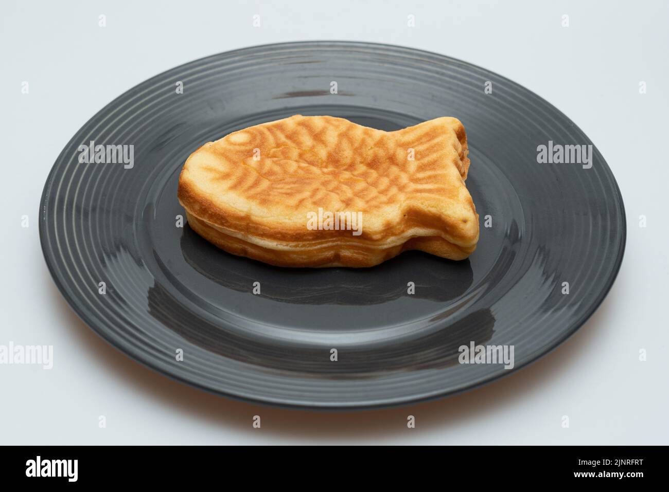 Sweet red bean bread in the shape of a crucian carp in a bowl Stock ...