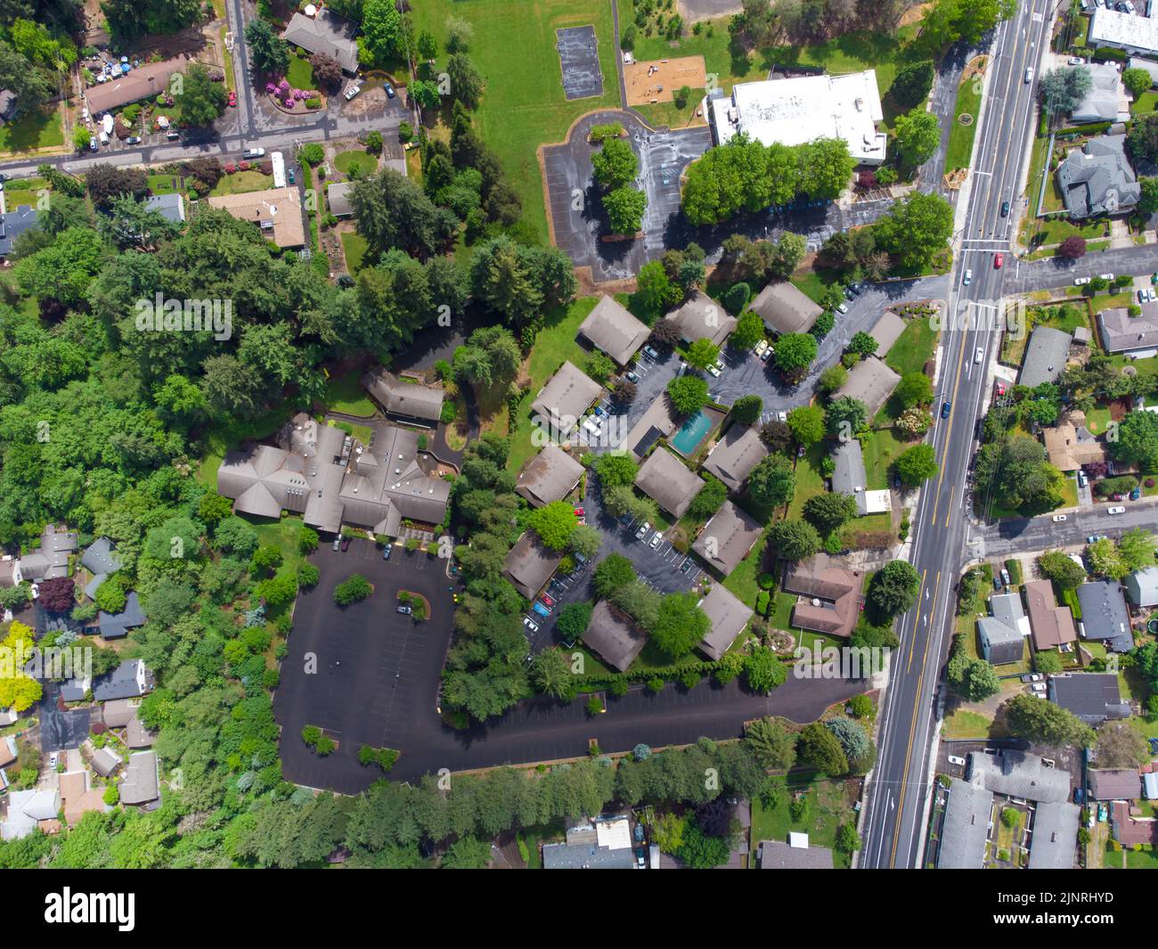 Top view of a small beautiful city. Lots of greenery, small one-story ...