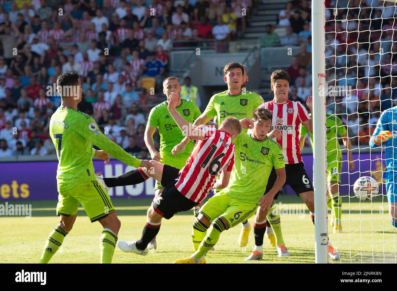 London, UK. 13th Aug, 2022. Ben Mee of Brentford scores his side third ...