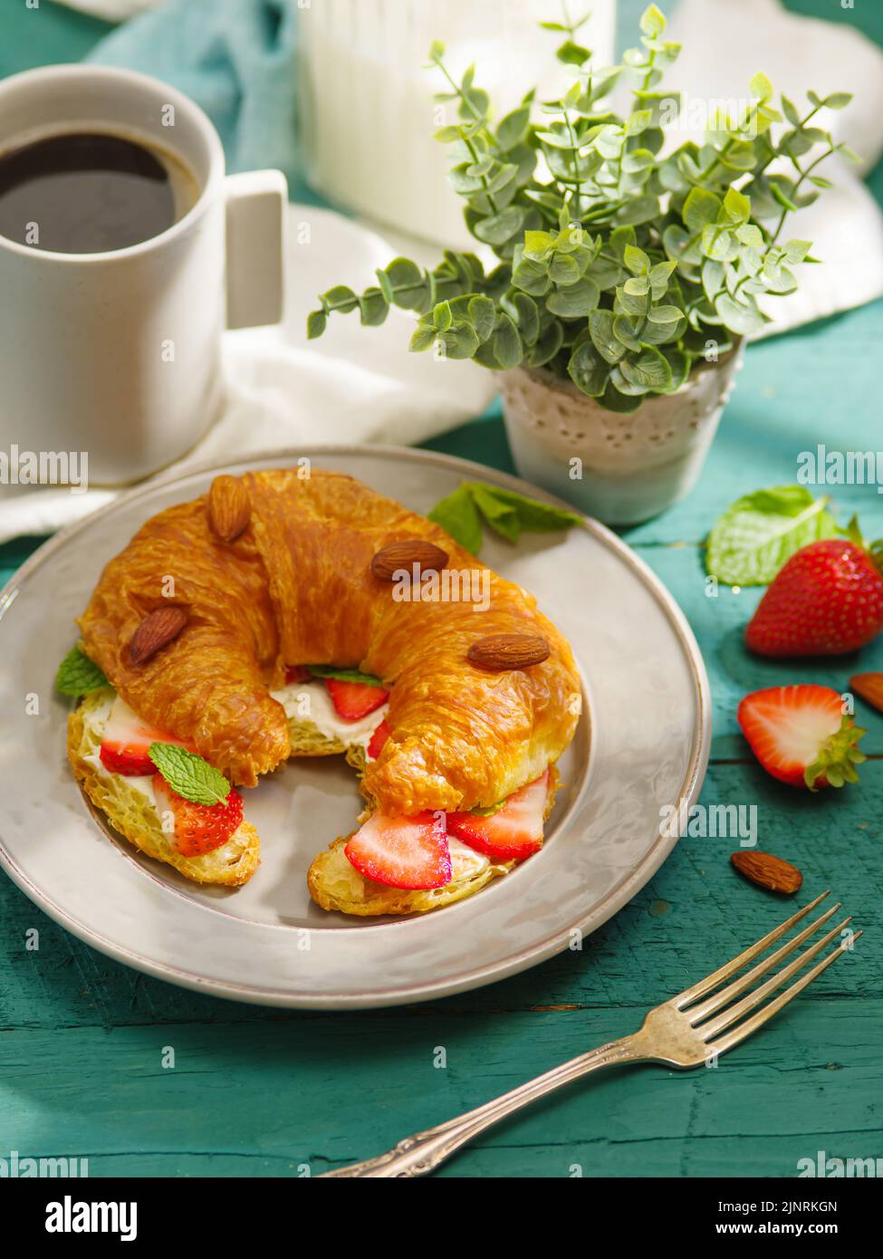 Classic continental breakfast. On a turquoise background, a French ...
