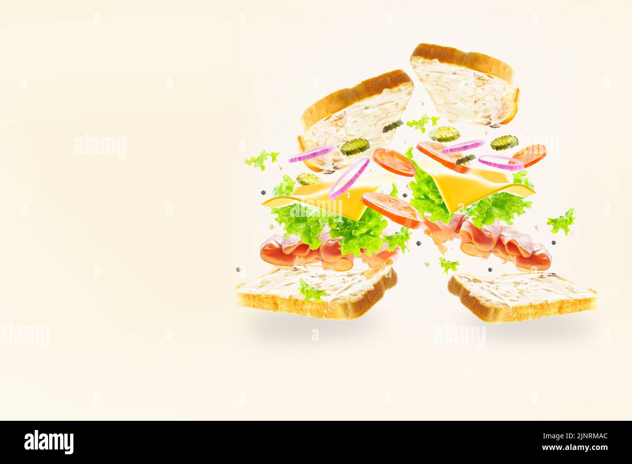 On a light background, two appetizing sandwiches with pieces of ...