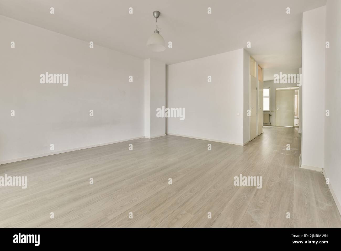 Interior of empty white room with large balcony windows with curtains ...