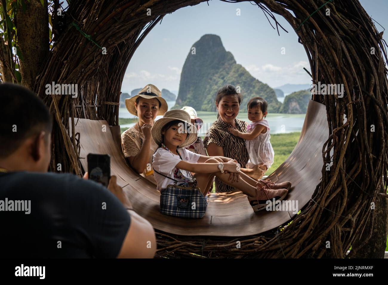 Phang Nga, Thailand. 13th Aug, 2022. A family takes a photo together in ...