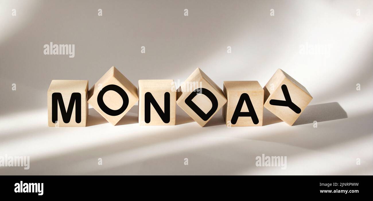 Wooden blocks with MONDAY concept text on white beautiful background ...