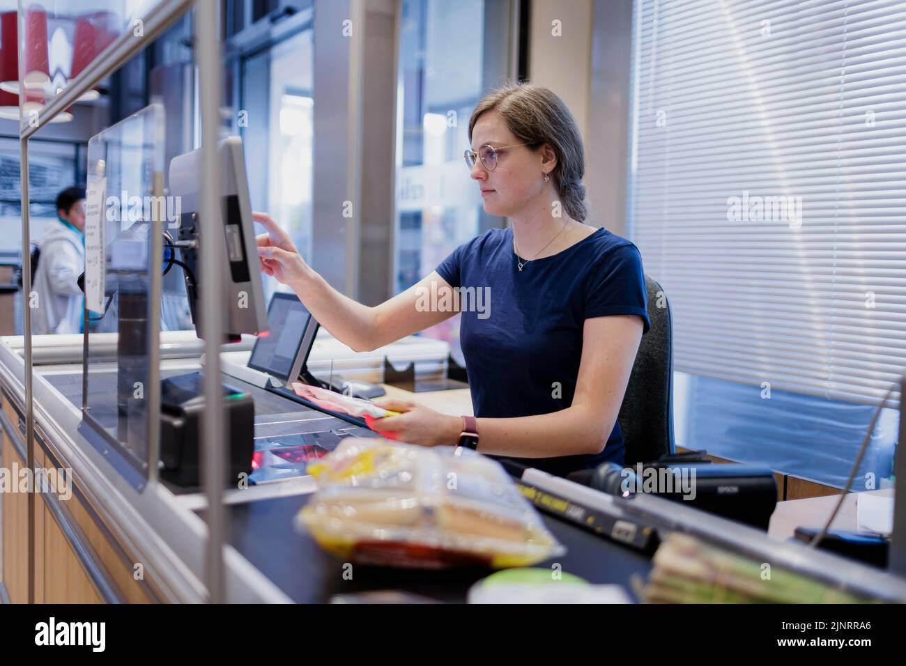 Radevormwald, Deutschland. 08th June, 2022. Cashier in the supermarket ...
