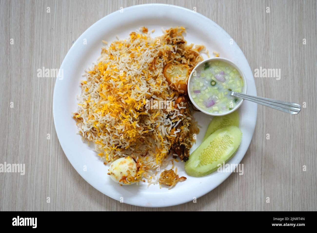 Table Top view of Indian Chicken Biryani Plate served with Egg and ...
