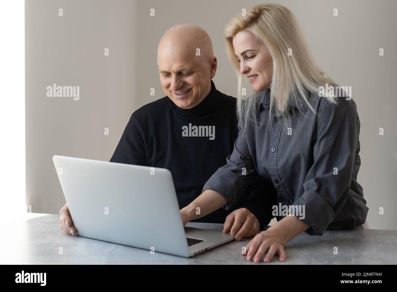 Front view happy elderly 70s grey haired man learning using computer ...