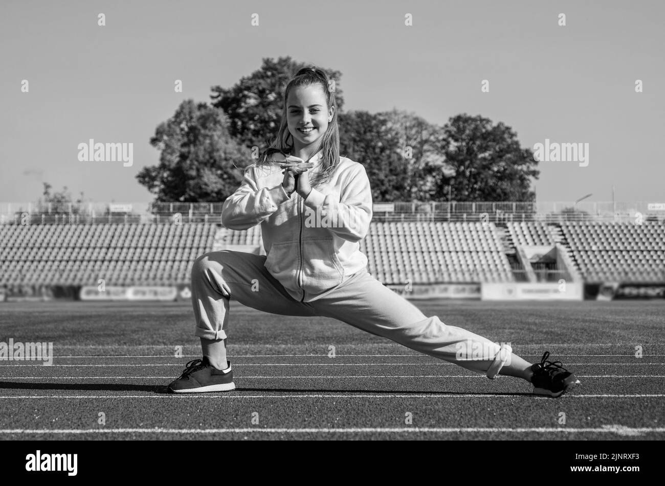 girl kid training sport outside on stadium arena, workout Stock Photo ...