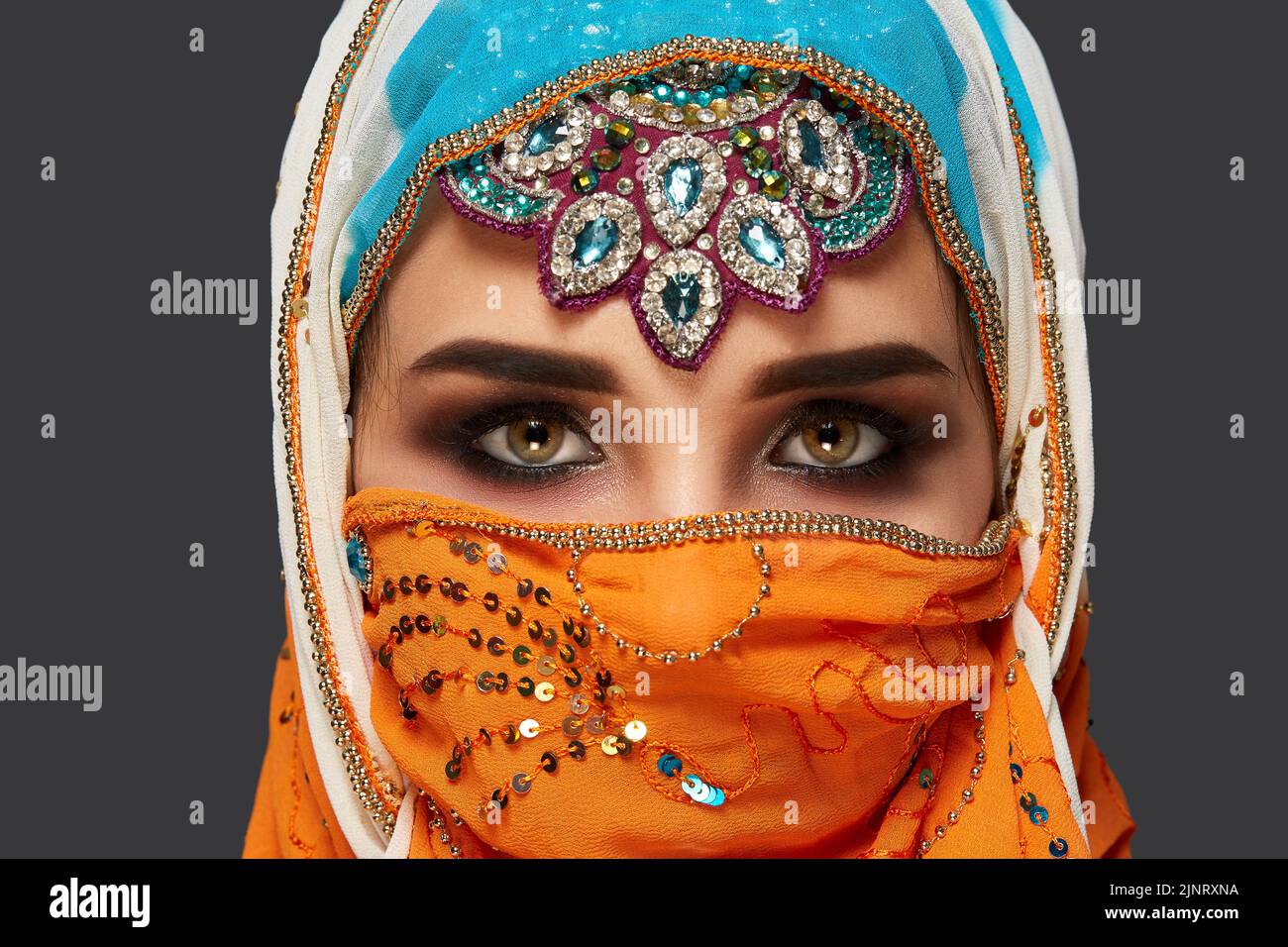 Studio shot of a chrming female wearing the colorful hijab decorated ...