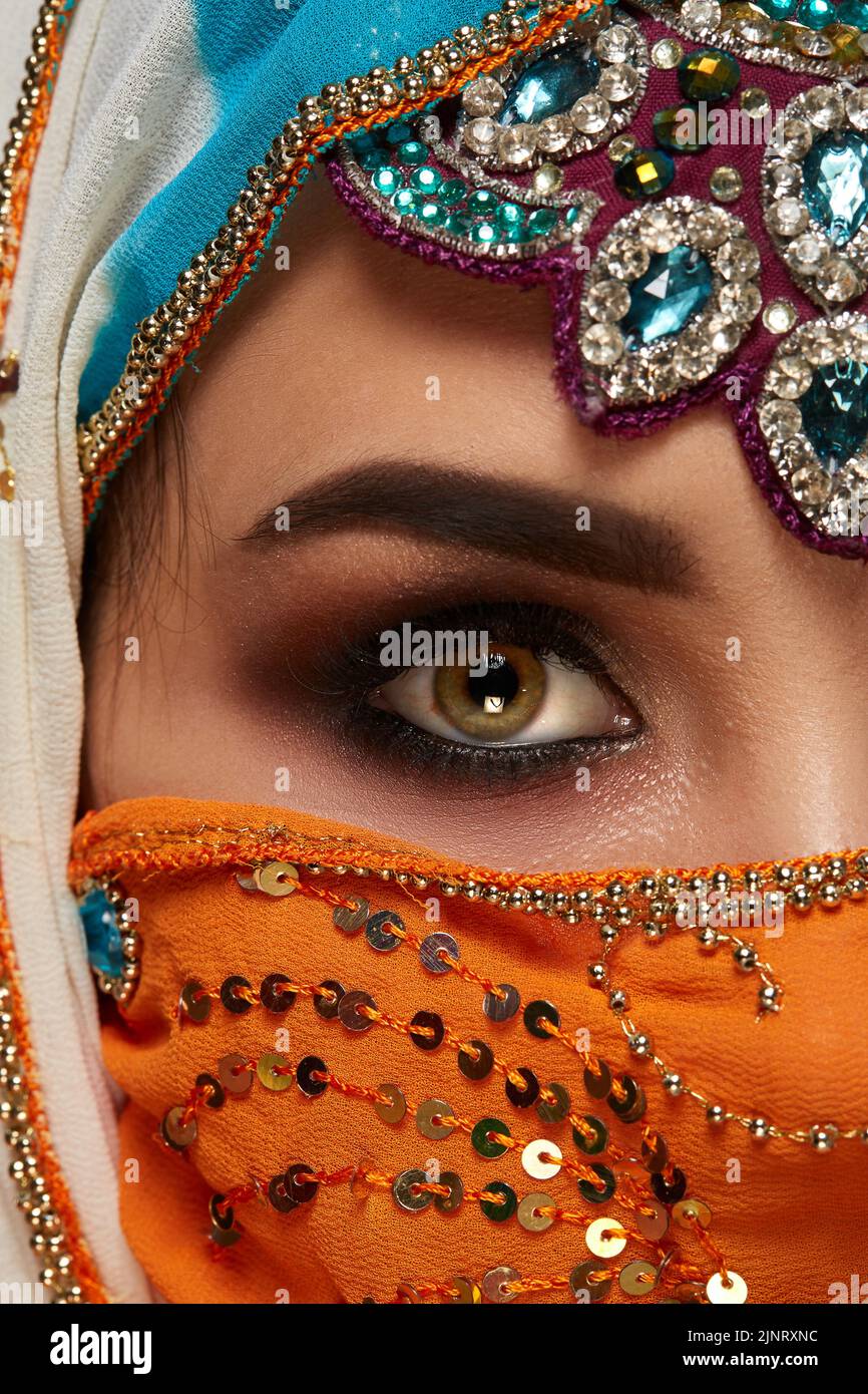 Studio shot of a chrming female wearing the colorful hijab decorated ...