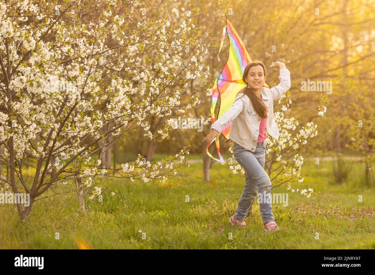 little girl with a kite in the spring Stock Photo - Alamy