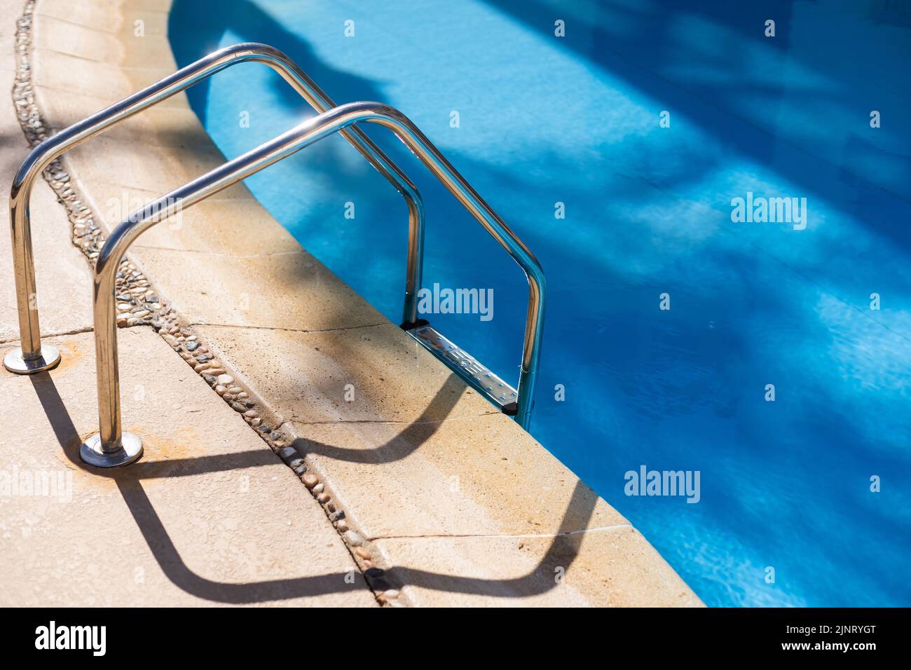 Stair around outdoor swimming pool in hotel resort for travel vacation ...