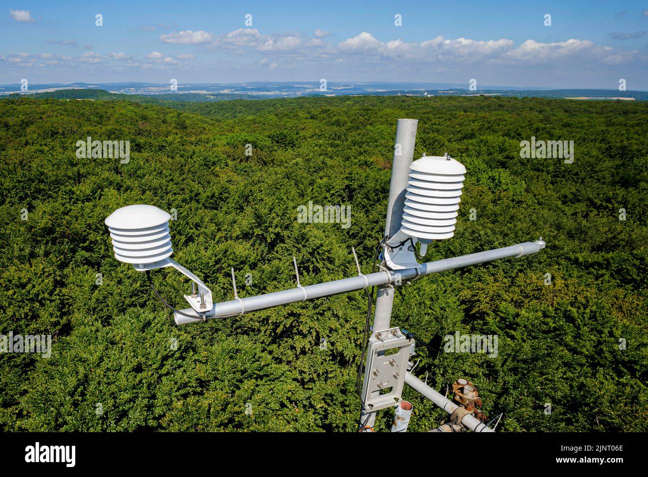 A hygrometer for recording air temperature and relative humidity hangs ...