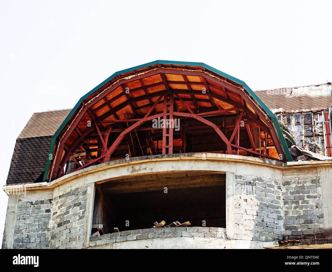 Unfinished building. Arched tiled roof on a metal frame base Stock ...