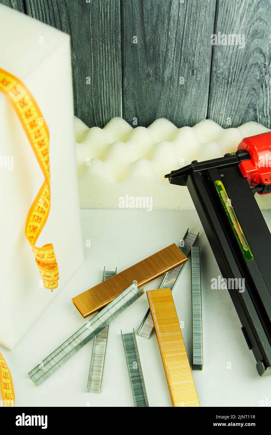 concept of furniture production and repair. Stapler and staples ...