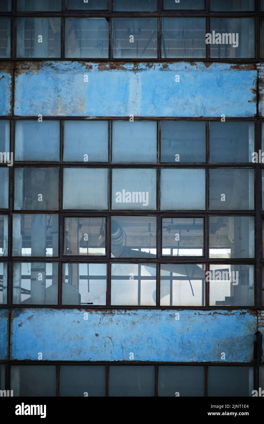 Old glass facade abandoned building Stock Photo - Alamy