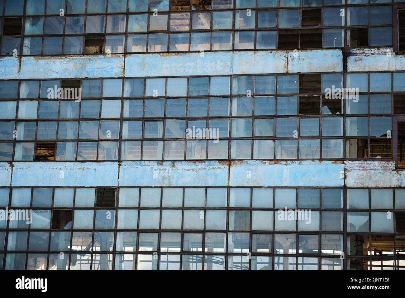 Broken glass facade old, industrial, abandoned factory building Stock ...