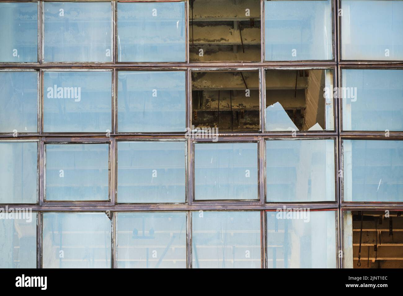 Broken glass facade old, industrial, abandoned factory building Stock ...