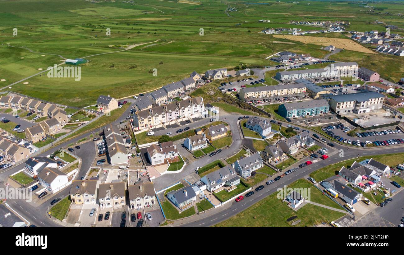 Kilkee town and public beach and surrounding cliffs around the crystal ...
