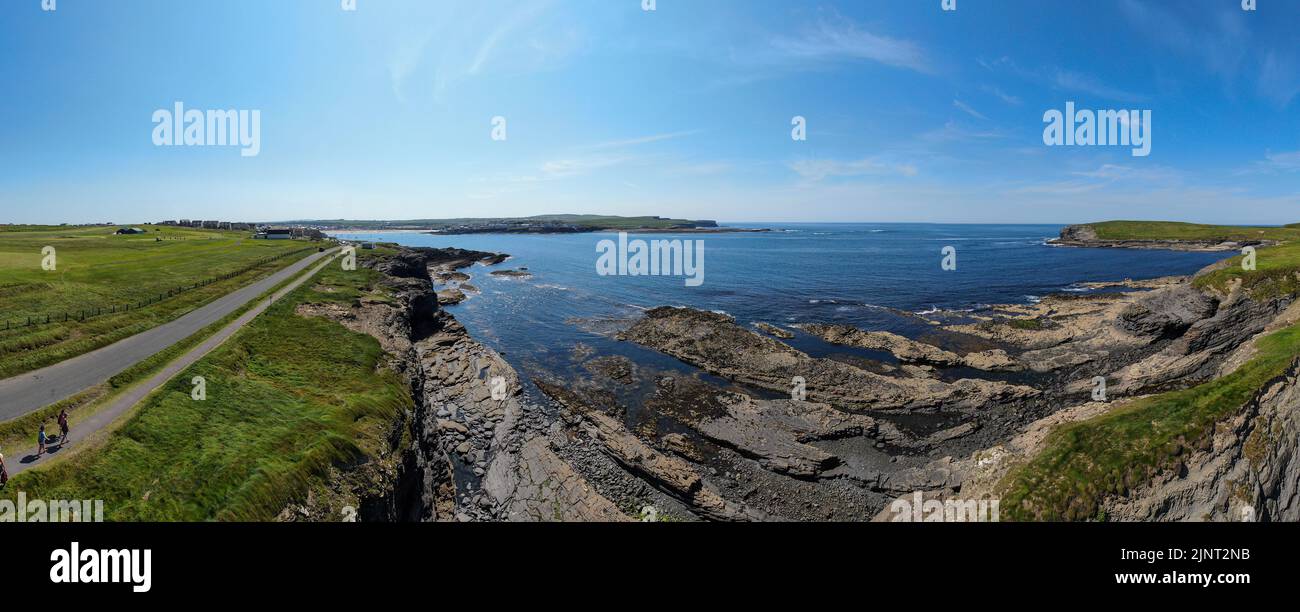 Kilkee town and public beach and surrounding cliffs around the crystal ...