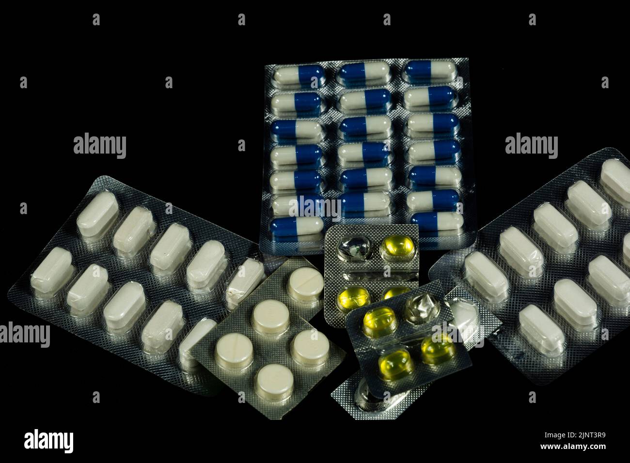 Pill pack for various diseases on a black background Stock Photo - Alamy