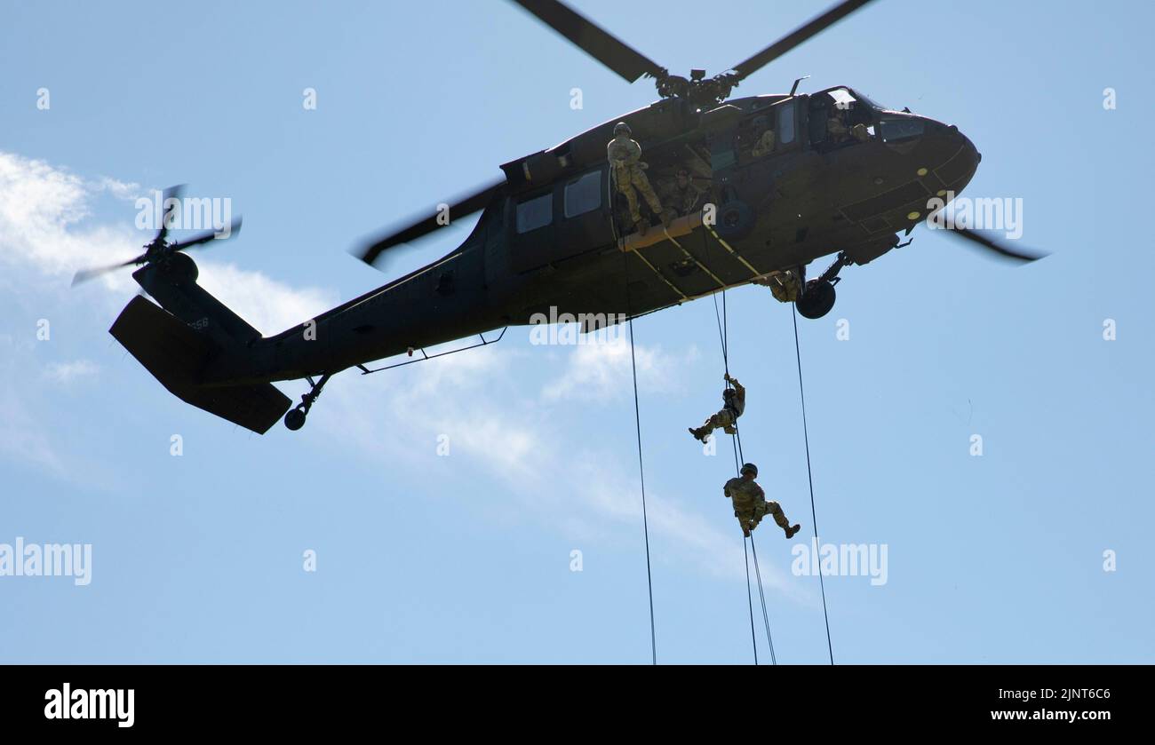 Two Soldiers rappel from a UH-60 Black Hawk helicopter during Air ...