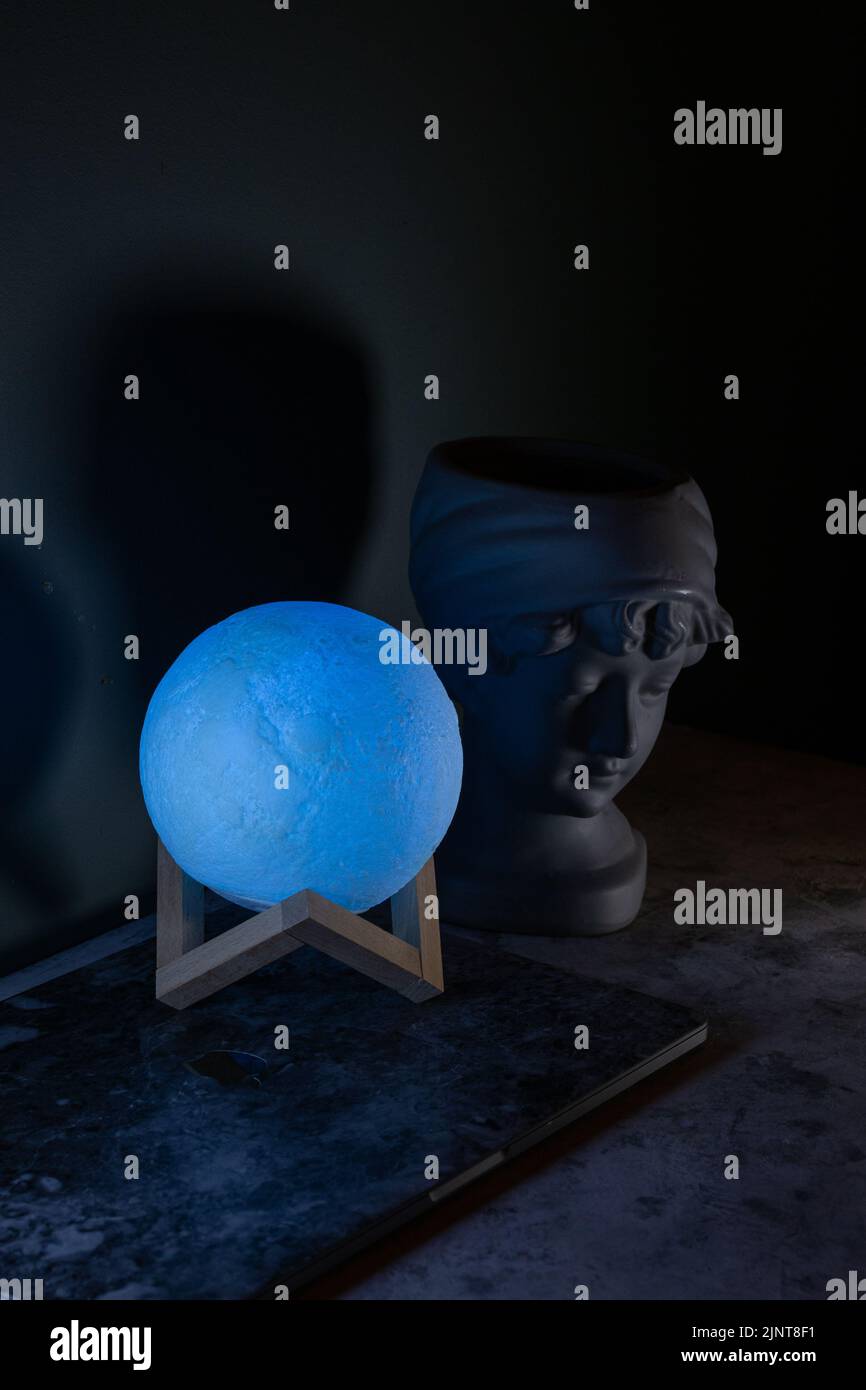 Moon lamp on the desktop in a dark room Stock Photo - Alamy