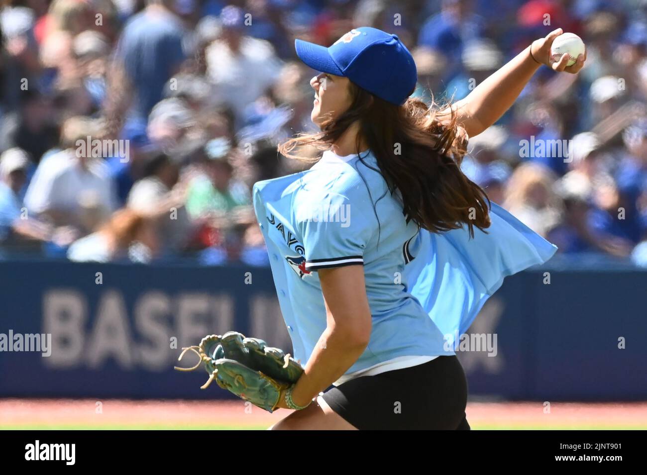 Jaida Lee throws out the ceremonial first pitch before the Toronto Blue ...