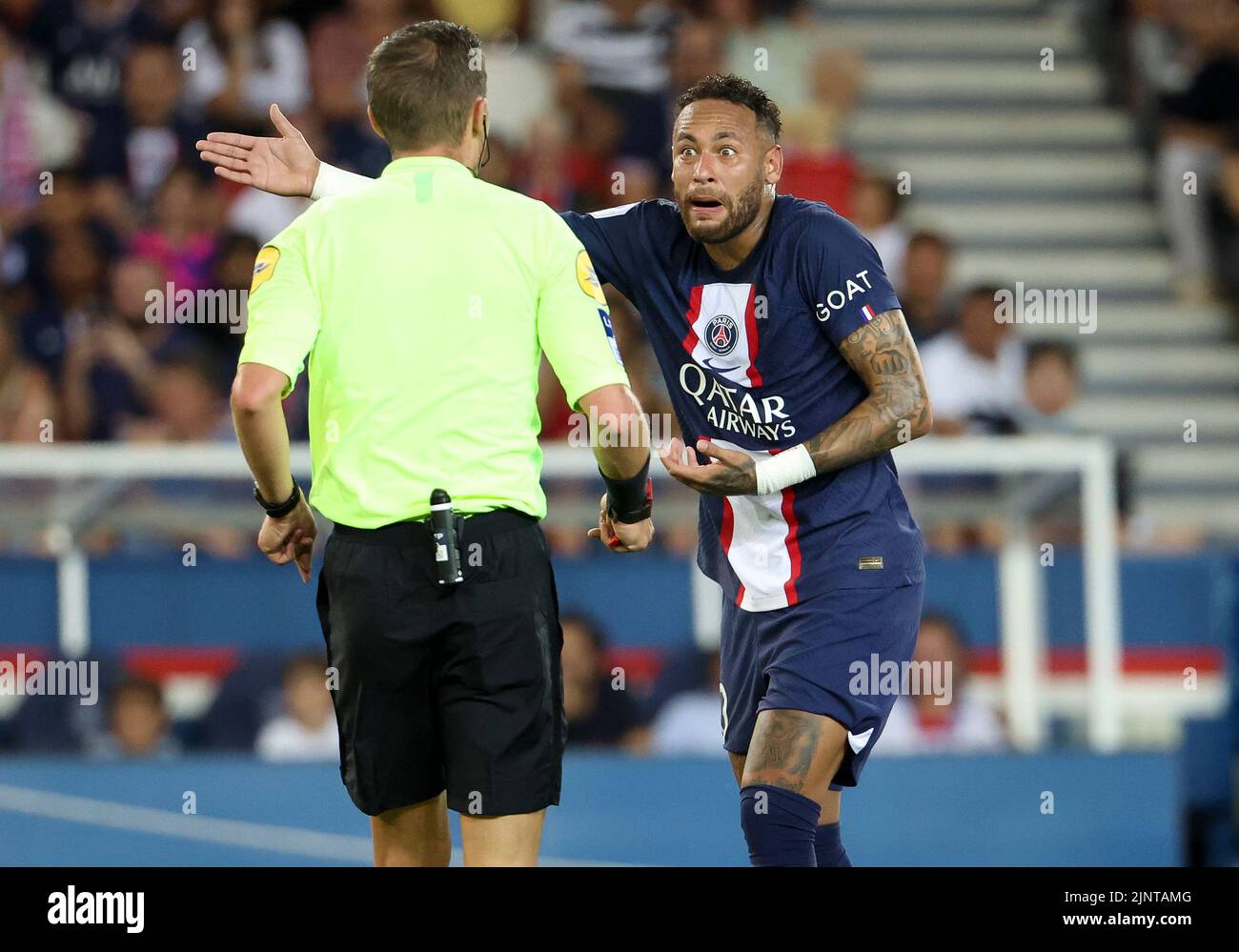 Neymar Jr of PSG argues with Referee Willy Delajod during the French ...
