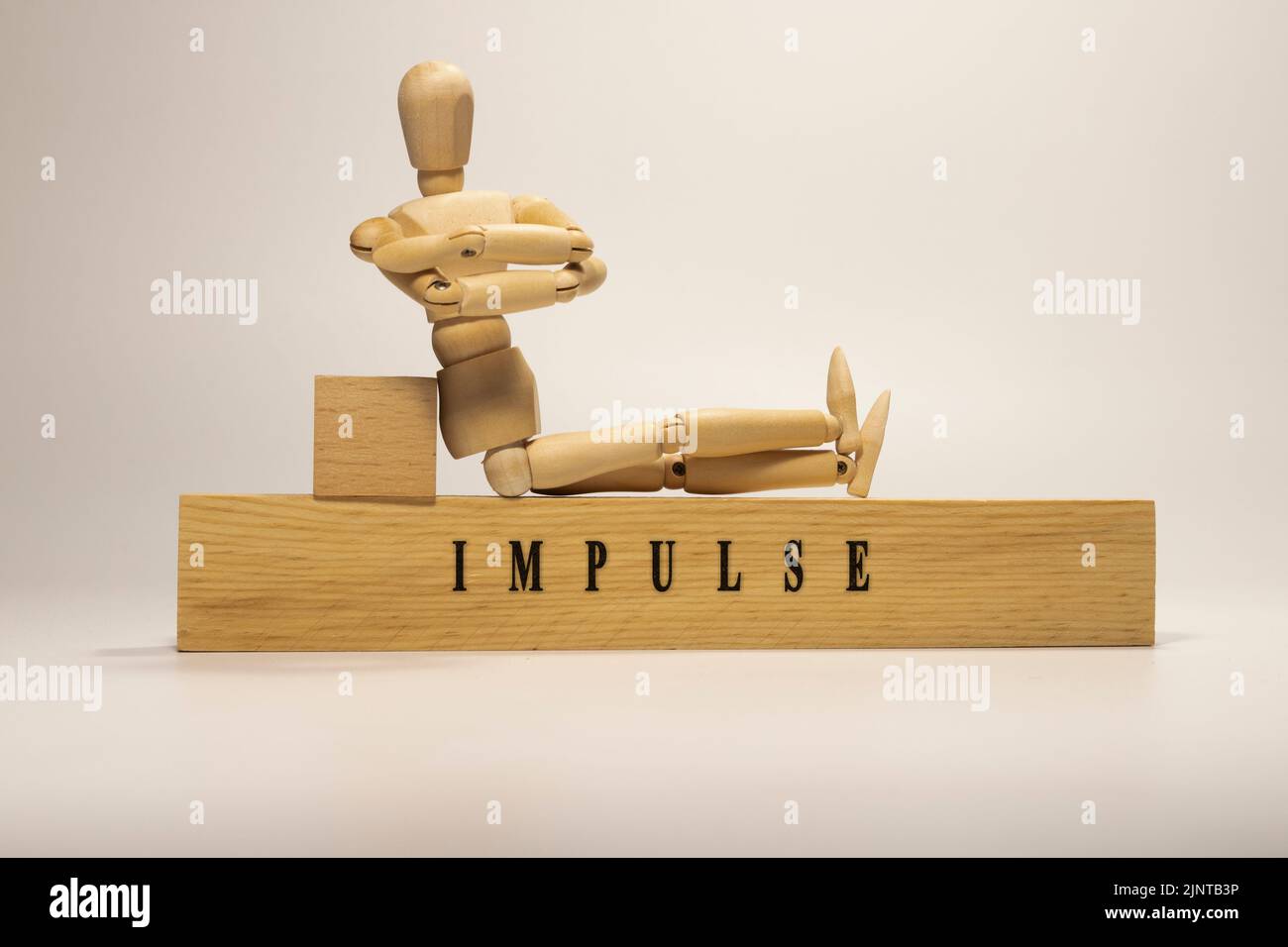 Impulse written on wooden surface. Motivation and personal development ...