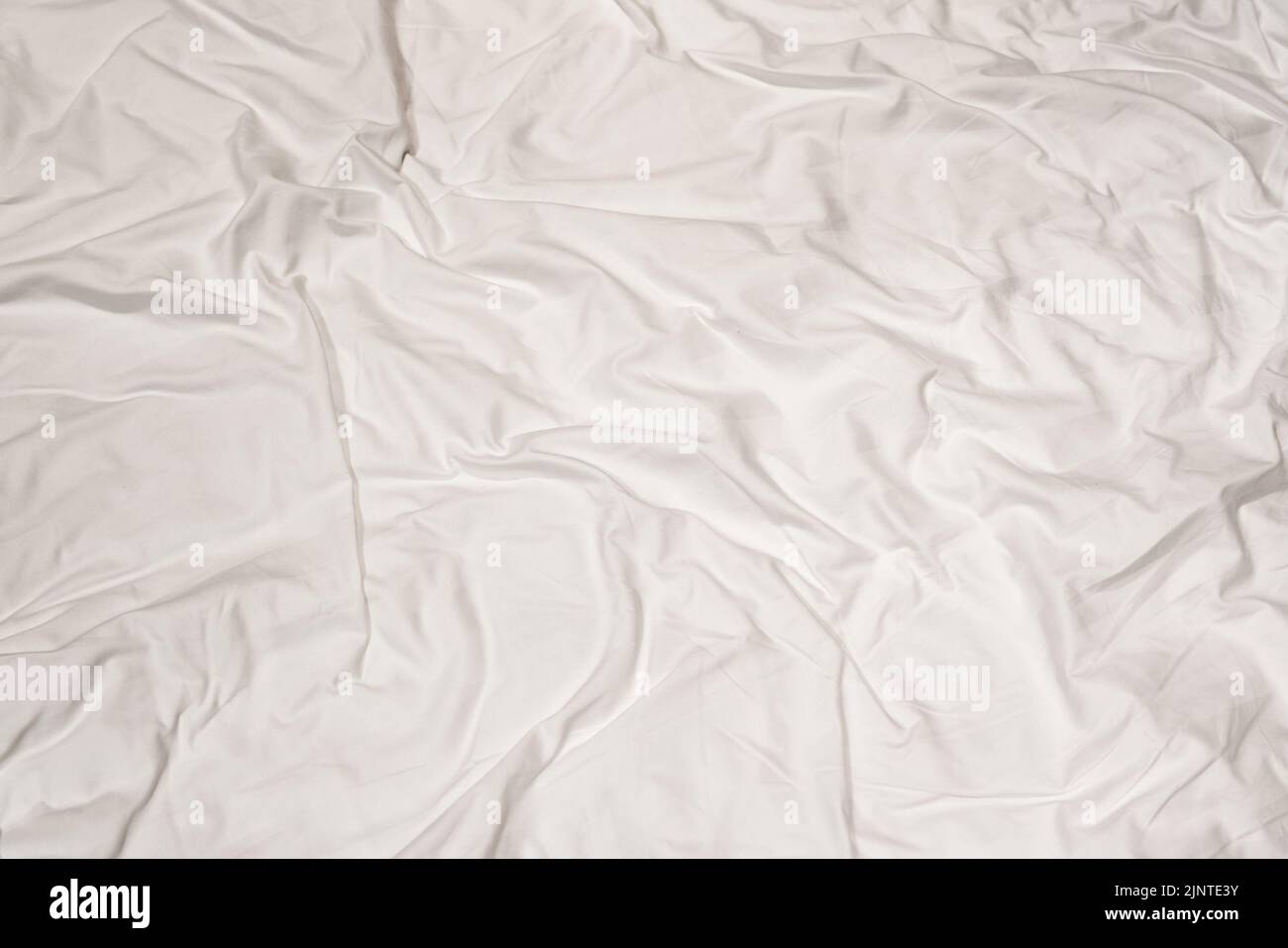 Crumpled white sheet texture with messy abstract pattern Stock Photo ...