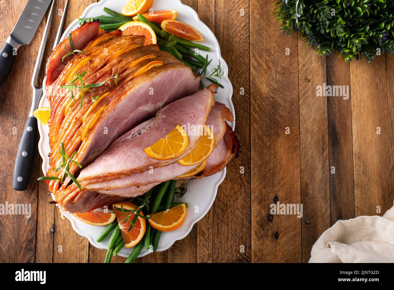 Christmas or Thanksgiving spiral sliced ham with oranges and herbs ...