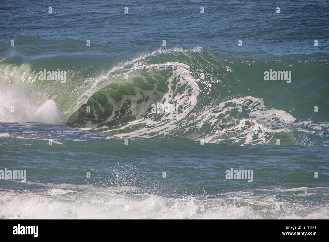 wave known as shorebreak at post six on Copacabana Beach in Rio de ...